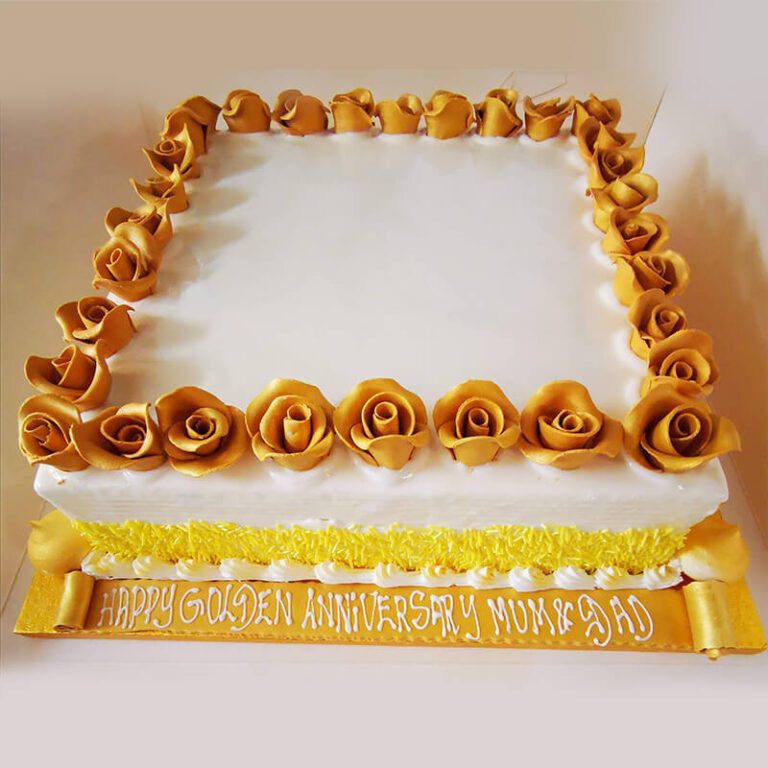 Golden Theme Anniversary Square Shape Cake With White Glaze On The Top ...